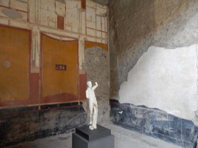 VI.15.1 Pompeii. June 2019. Statue of Priapus on display in south ala ...